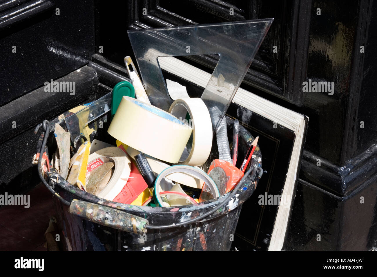 Black bucket full of handiman's tools Stock Photo - Alamy