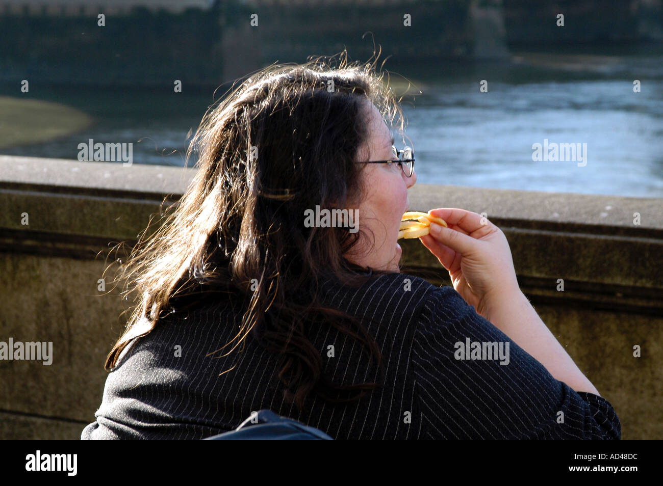 Fat person eating chips hi-res stock photography and images - Alamy
