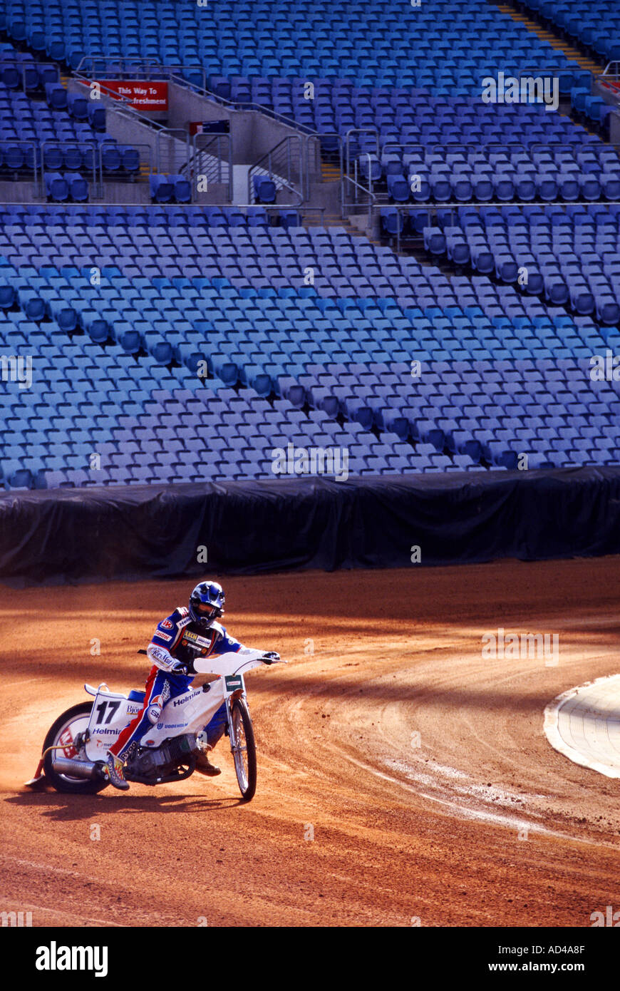 Off road alcohol powered motorbike flying around the corner of a ...