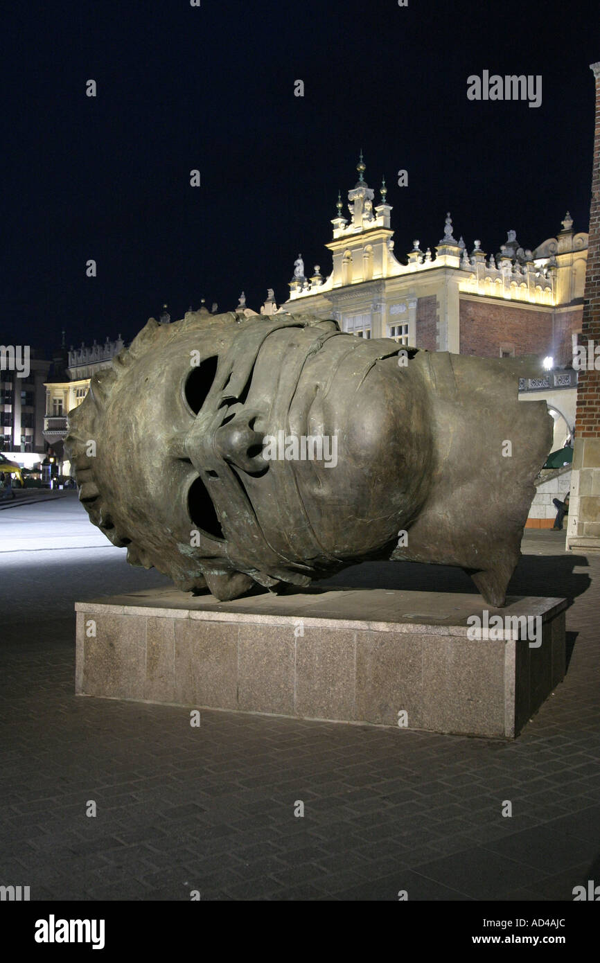 Statue of a man's face in Krakow, Poland Stock Photo - Alamy