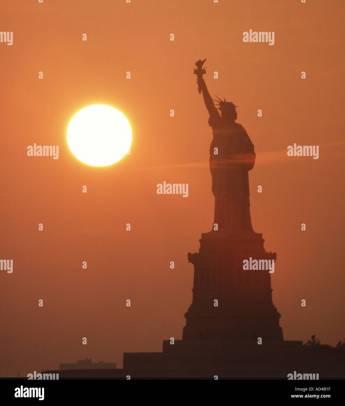 Statue of Liberty in New York Harbor USA at sunset Stock Photo - Alamy