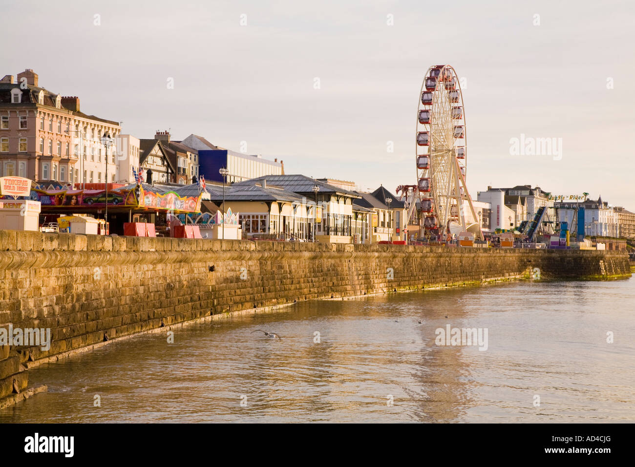 Funfair alongside the harbour wall at Bridlington Yorkshire coast Stock ...
