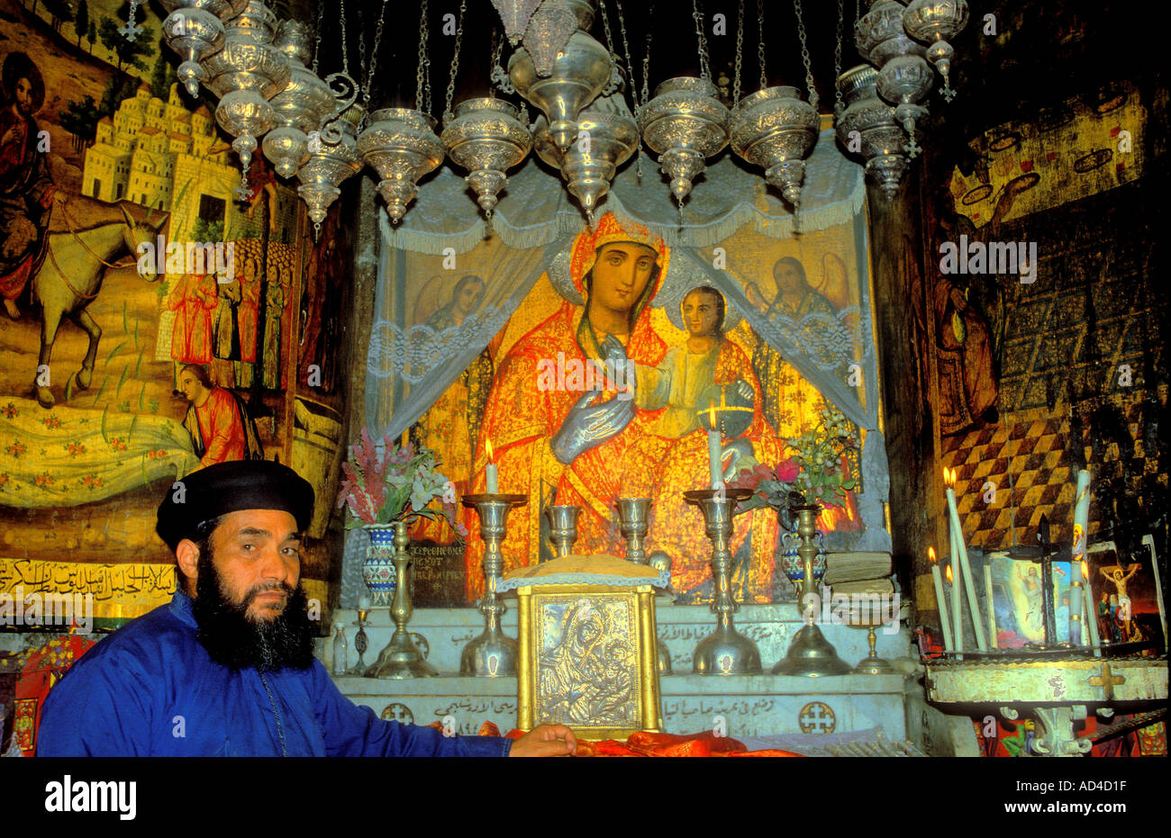 Priest at the altar of a chapel in the Church of the Holy Sepulchre ...