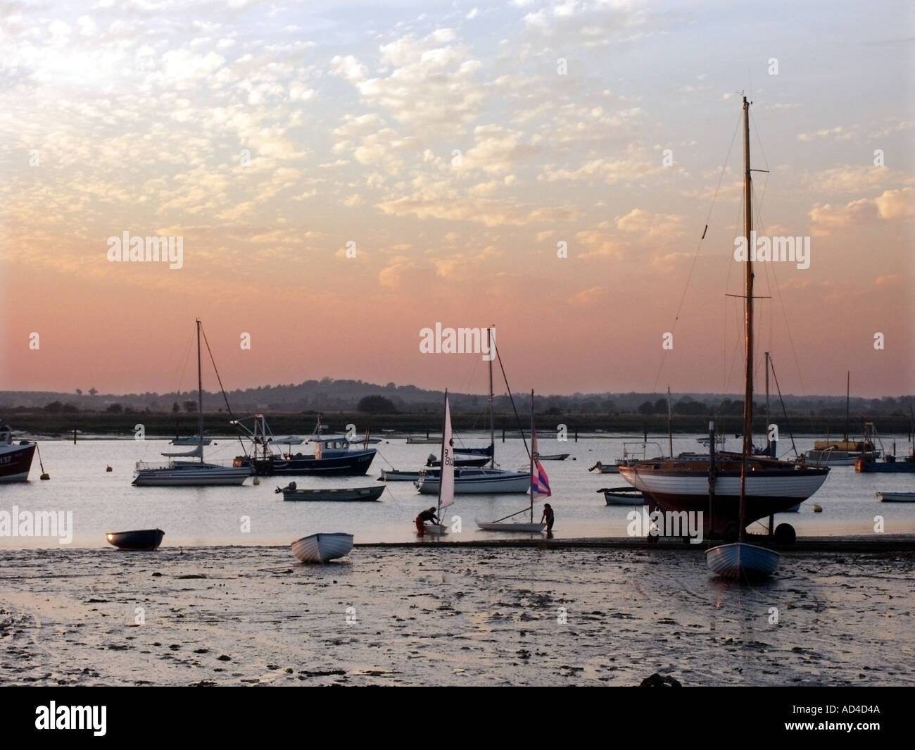 West Mersea sunset and boats at moorings at low tide on the Strood ...
