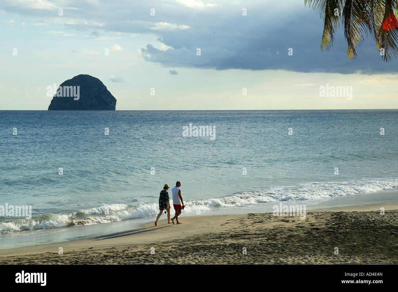 People walking on the beach Stock Photo - Alamy