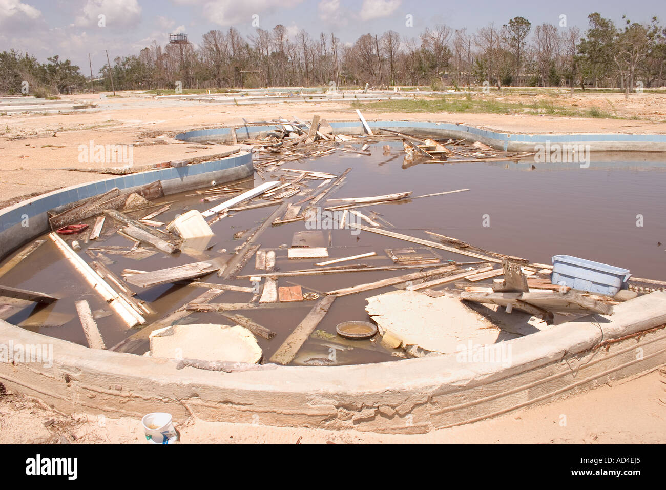 Storm debris and pool are all that remain on this site of former condo ...