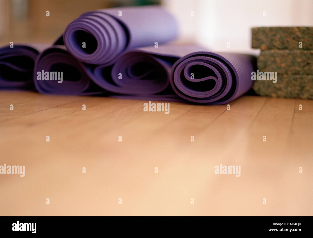 Exercise mats rolled up Stock Photo - Alamy