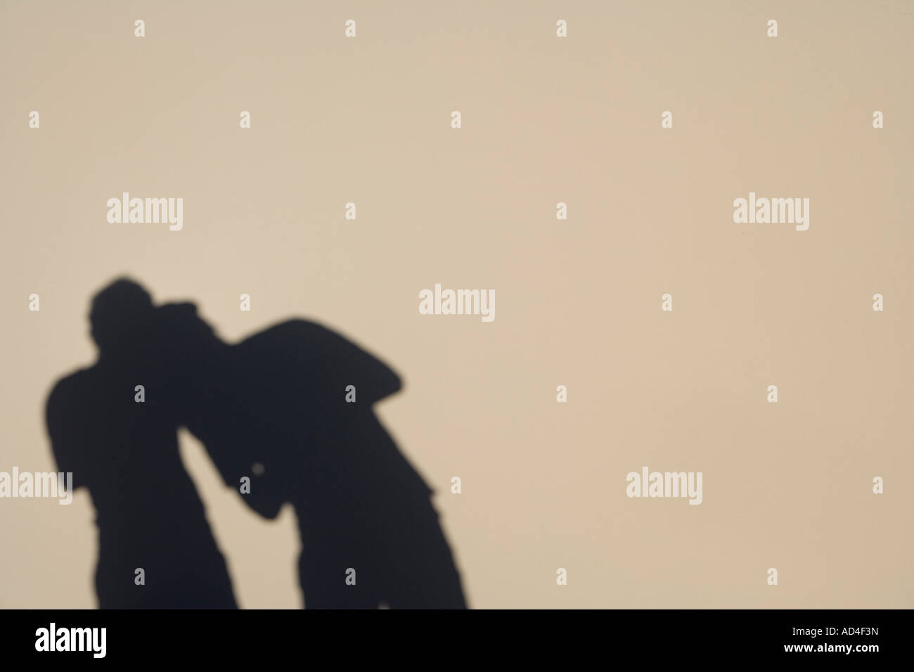 Shadow of two people on a wall Stock Photo - Alamy