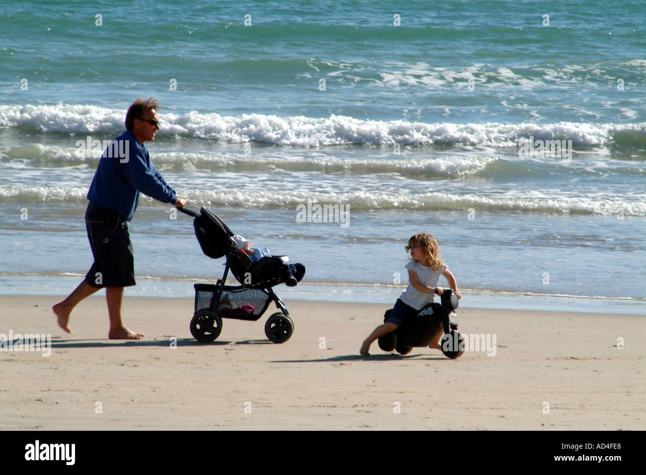 Pushing pushchair hi-res stock photography and images - Alamy