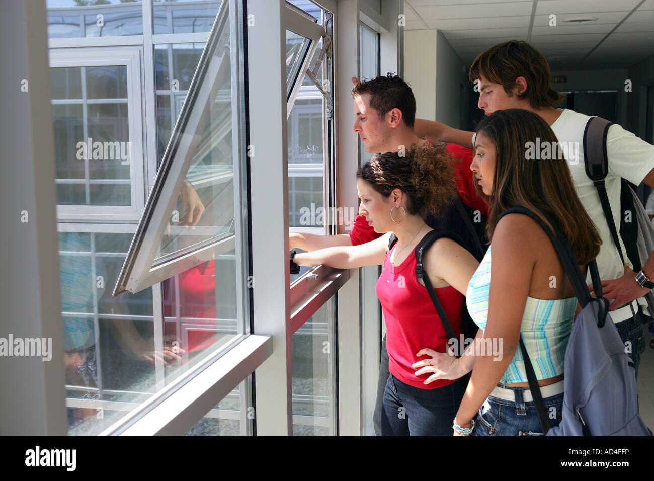 Students looking out the window Stock Photo - Alamy