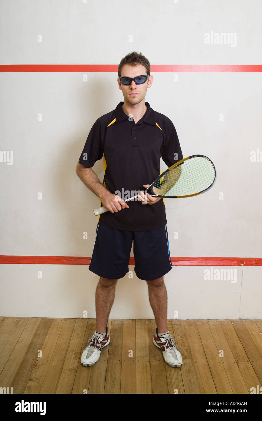 A man standing on a squash court Stock Photo - Alamy