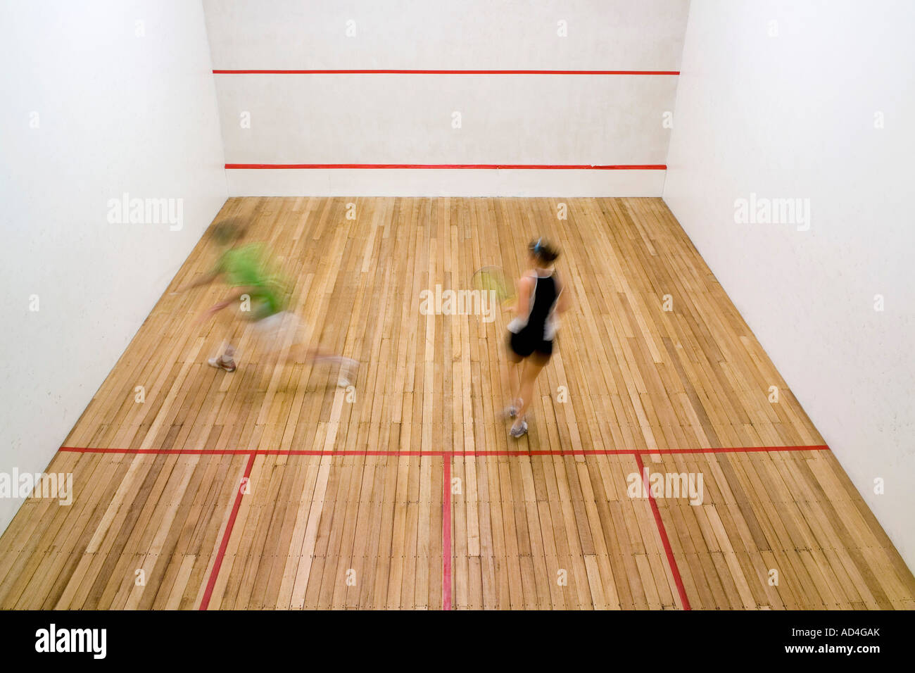High angle view of two people playing squash Stock Photo - Alamy