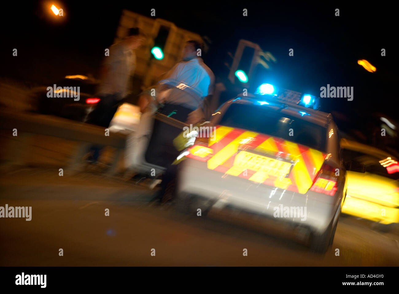 Traffic police vehicle at night on motorway England abstract concept ...
