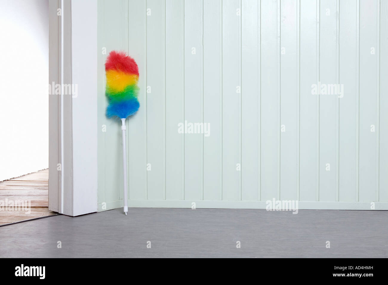 Multi-colored duster in a corner Stock Photo - Alamy