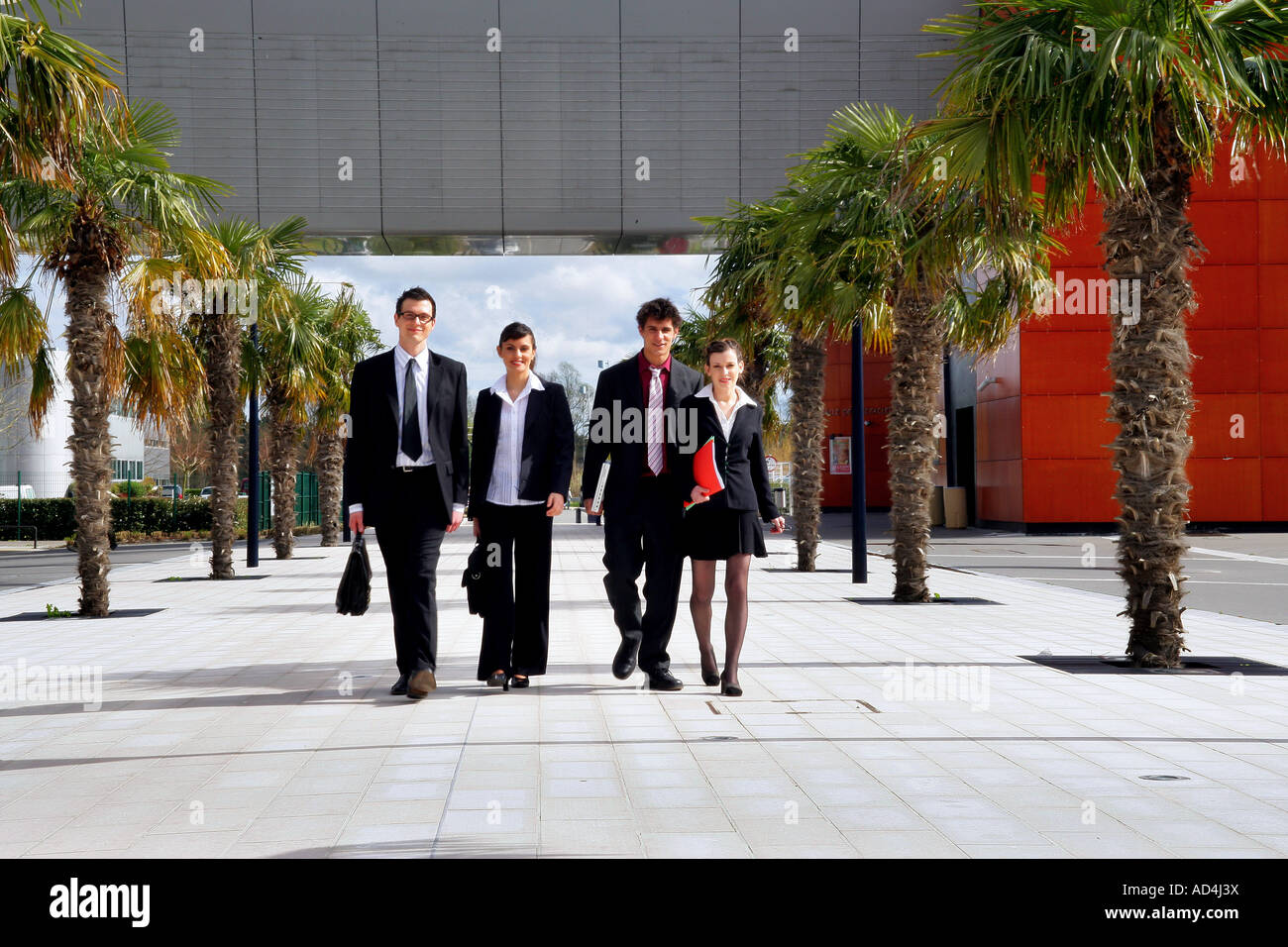 Group of professionals walking Stock Photo - Alamy