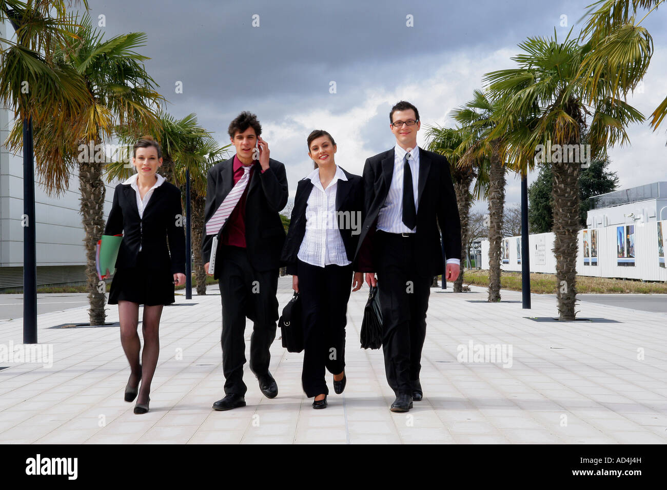 Group of professionals walking Stock Photo - Alamy