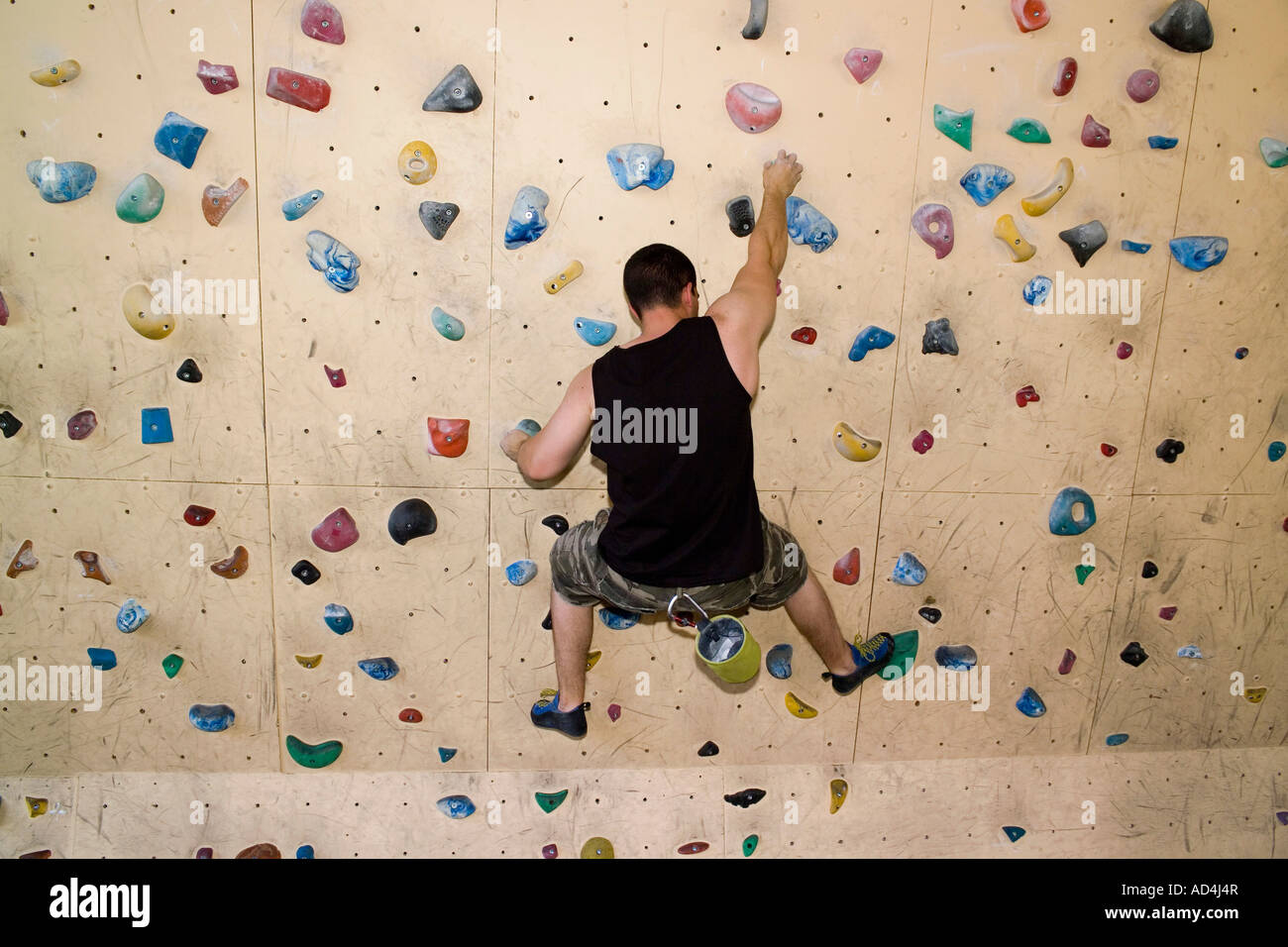 Rear view of a man rock climbing hi-res stock photography and images ...