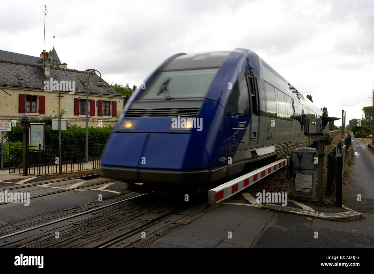 French train passing through unmanned level crossing chenonceau loire ...