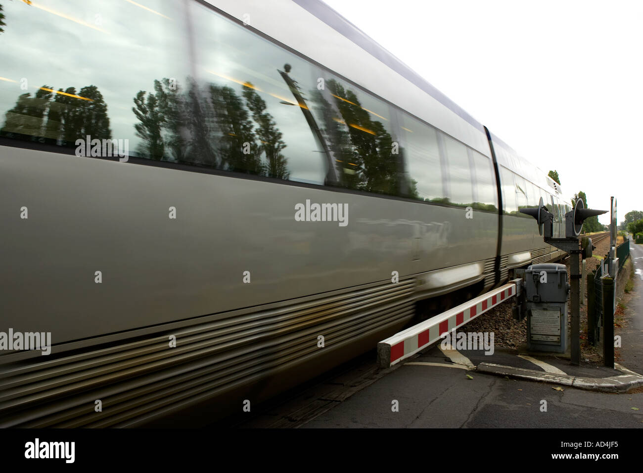 French train passing through unmanned level crossing chenonceau loire ...