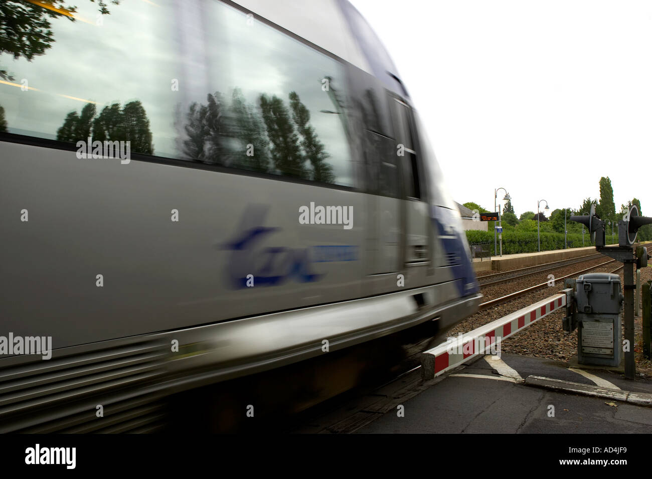 French train passing through unmanned level crossing chenonceau loire ...