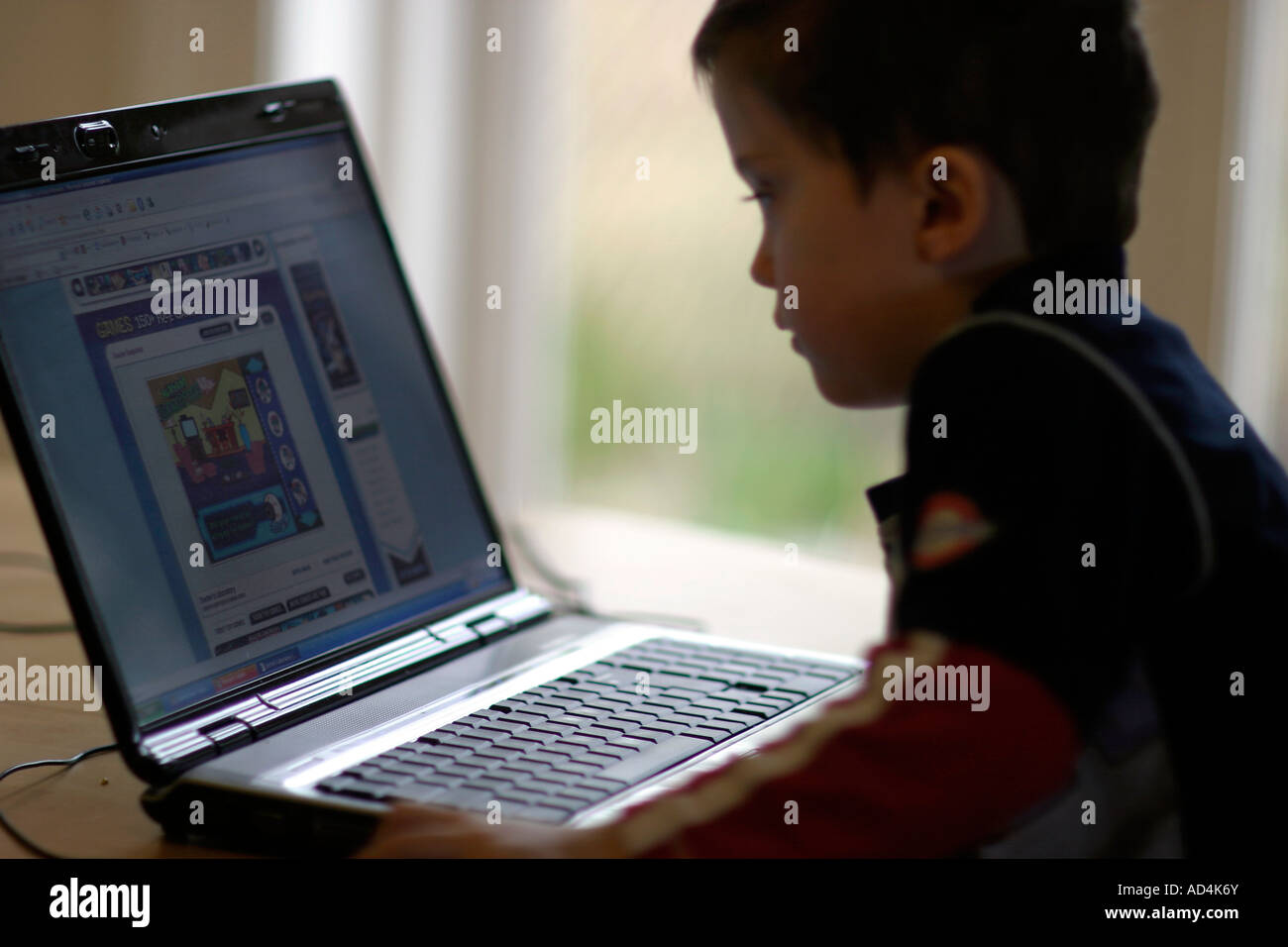 small boy using a portable computer Stock Photo - Alamy
