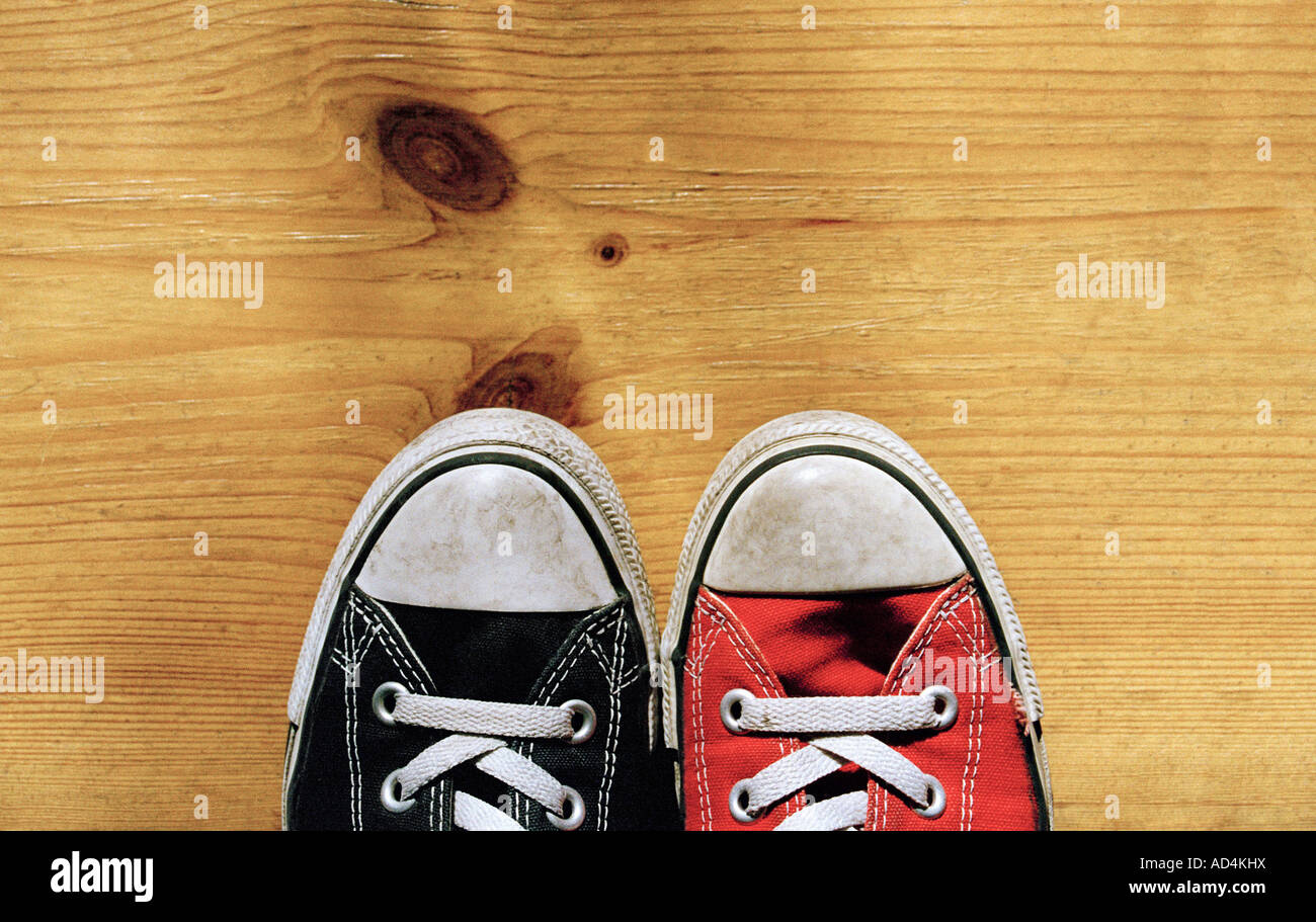 An odd pair of canvas shoes Stock Photo - Alamy