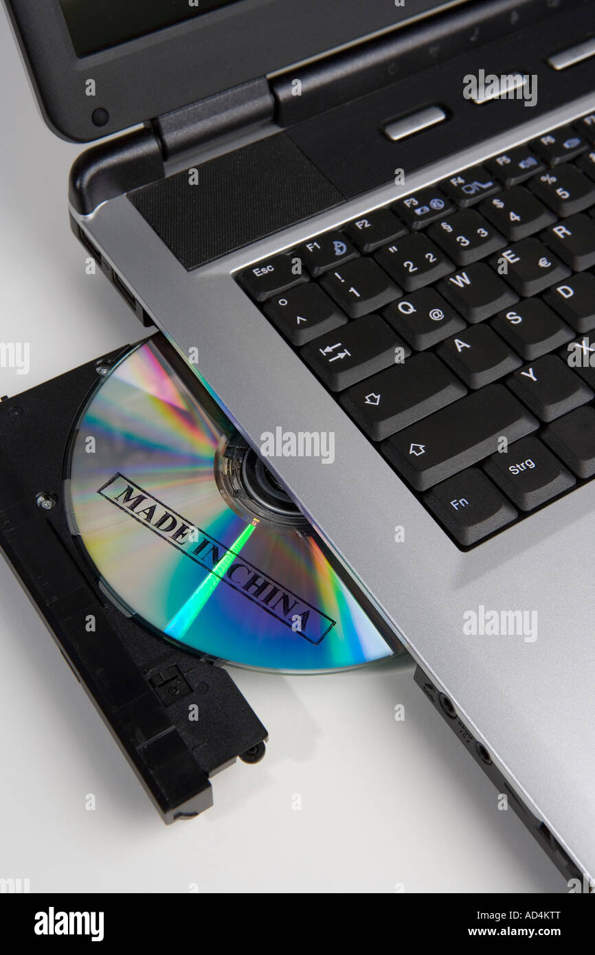 CD stamped 'Made in China' in the disc drive of a laptop computer Stock ...