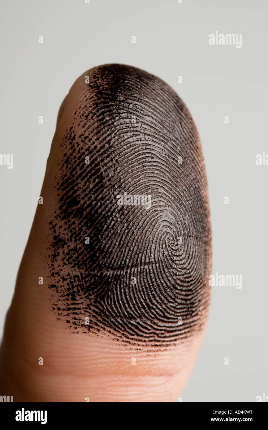 Detail of a thumb covered in black ink Stock Photo - Alamy