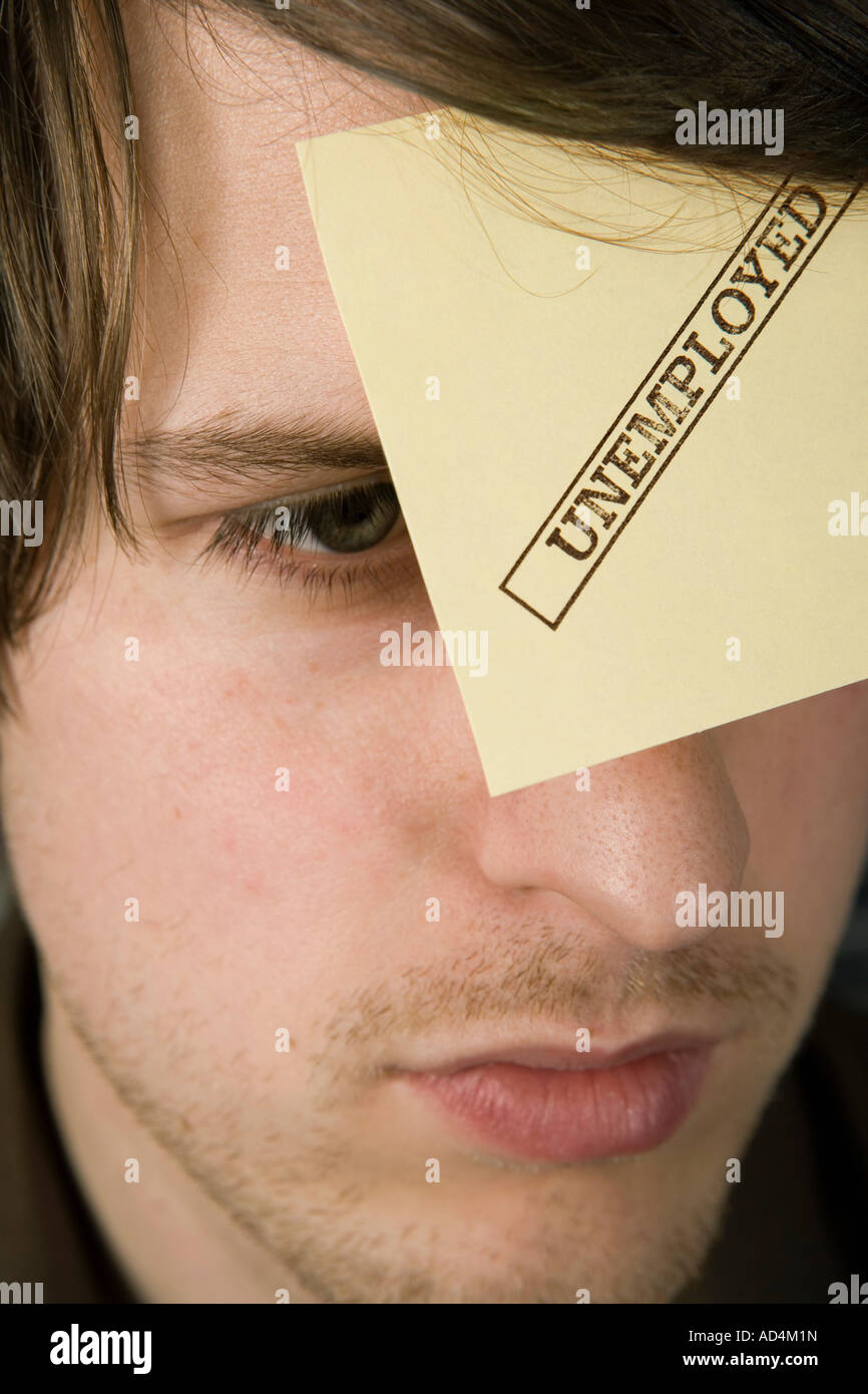 A man with an adhesive note on his forehead stamped 'Unemployed' Stock ...