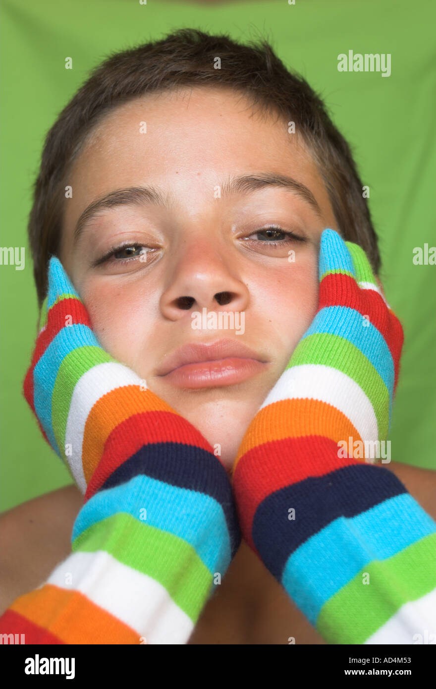 Serious boy hiding hi-res stock photography and images - Alamy
