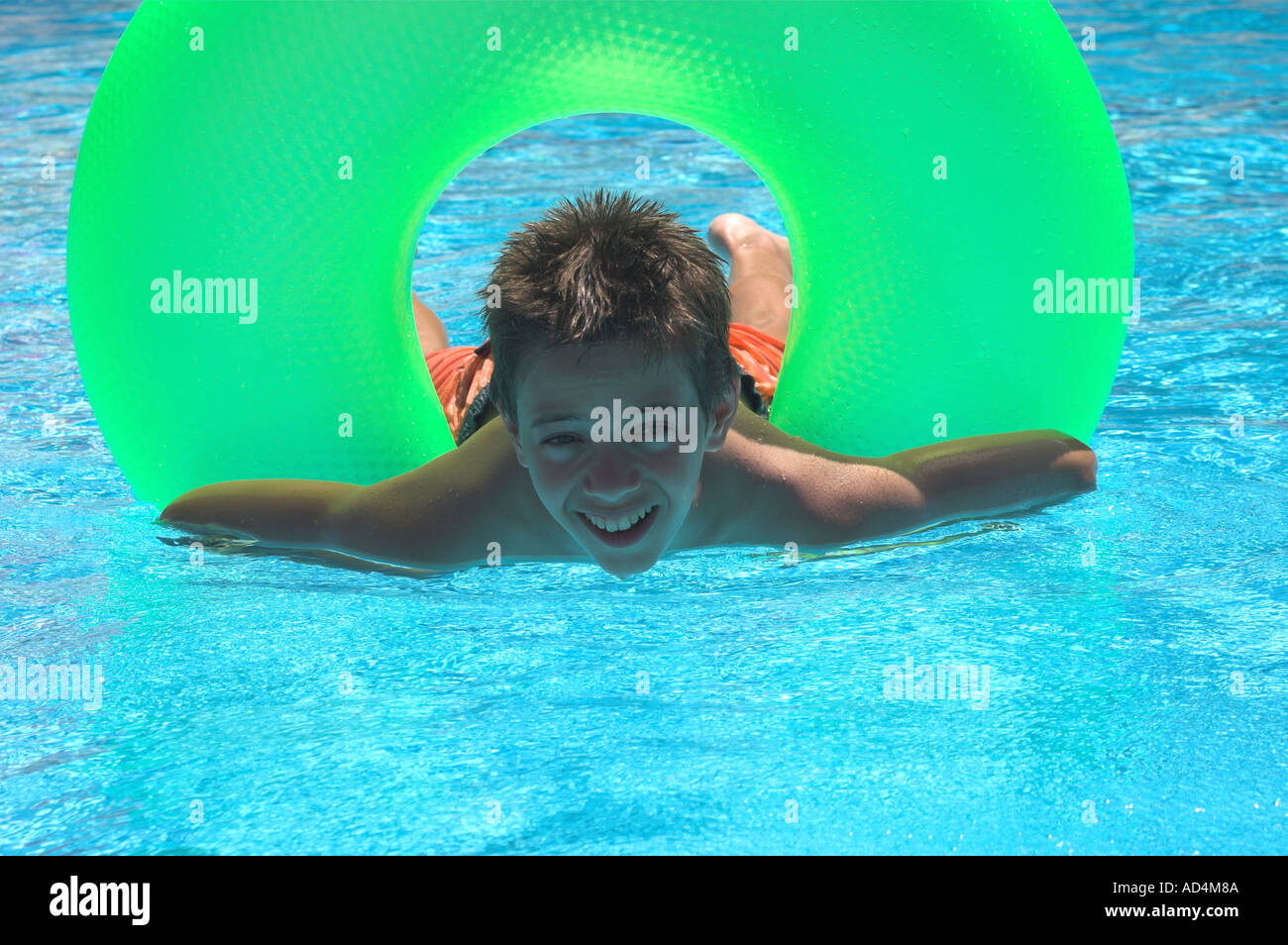 boy sunbathing in the swimming pool Stock Photo - Alamy