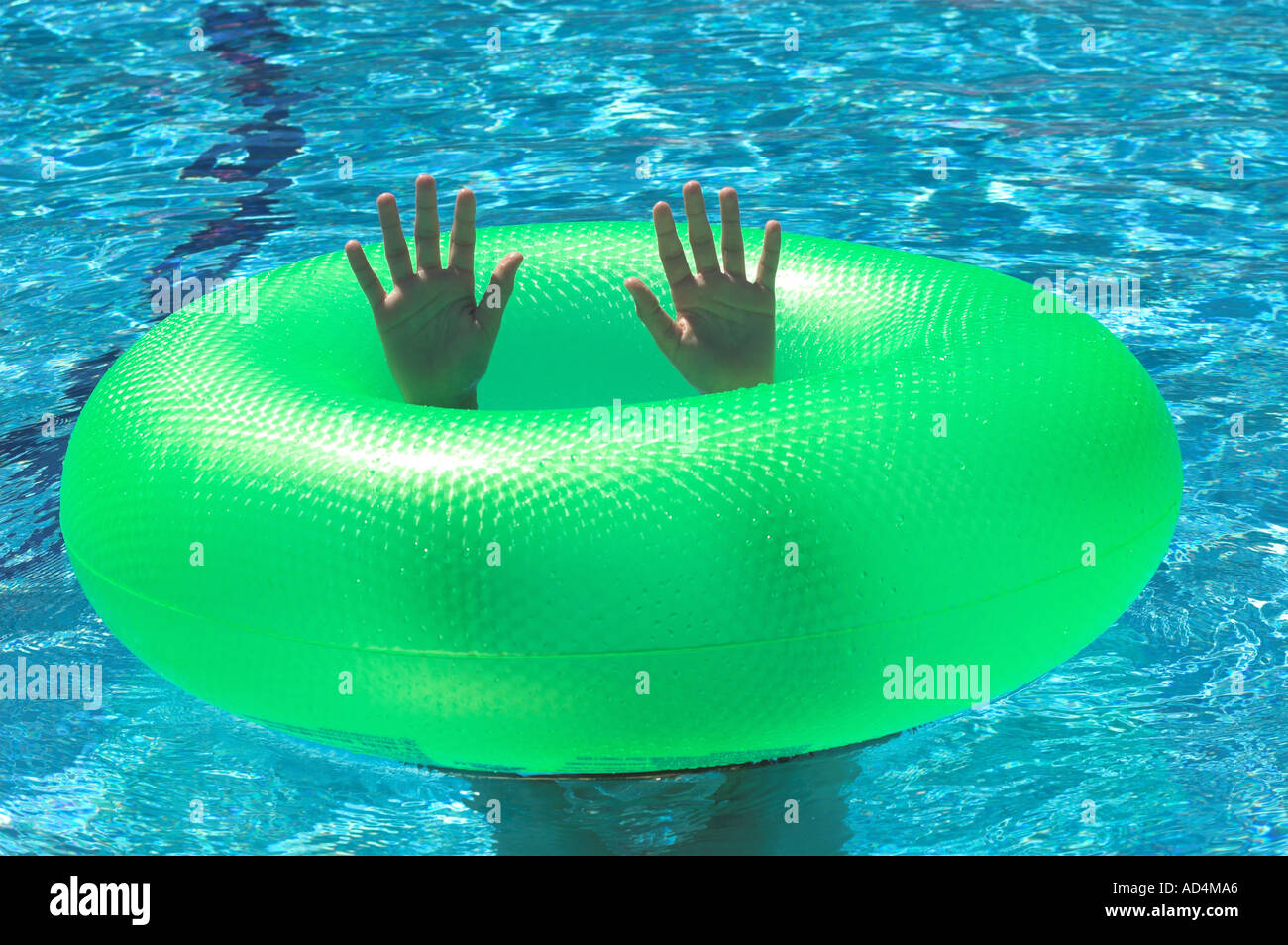 boy with hands out of the floater Stock Photo - Alamy