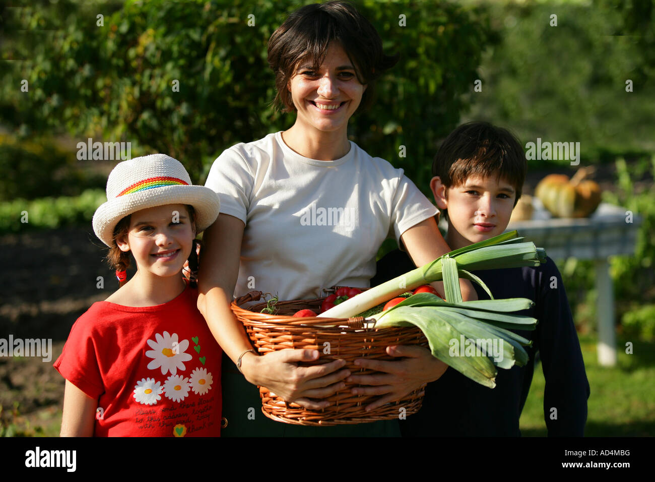 Woman and children in the countryside Stock Photo - Alamy