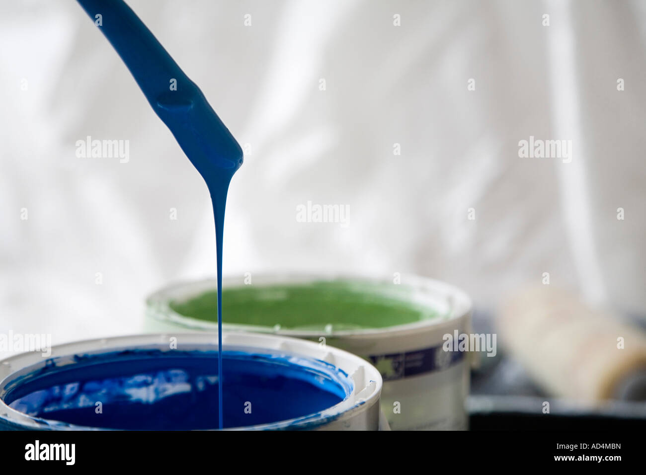 Paint dripping from a paintbrush Stock Photo - Alamy
