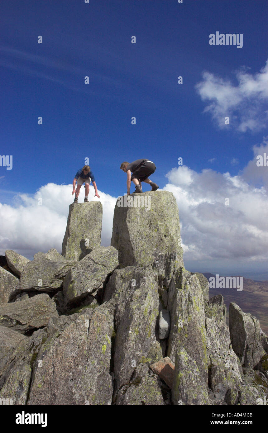 Preparing to make the jump on Adam and Eve on the summit of Tryfan in ...