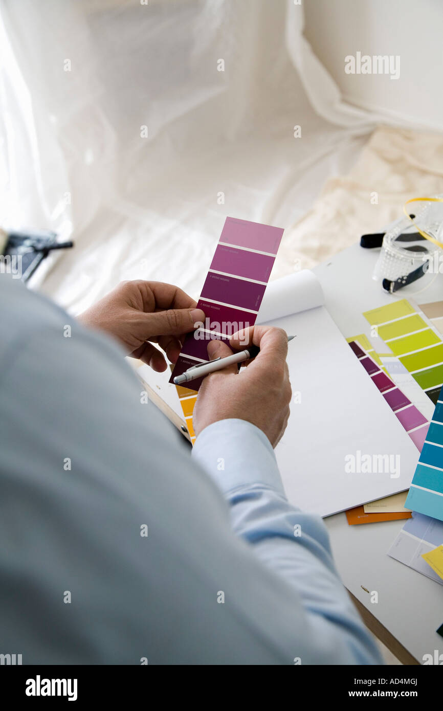 A man comparing color samples Stock Photo - Alamy