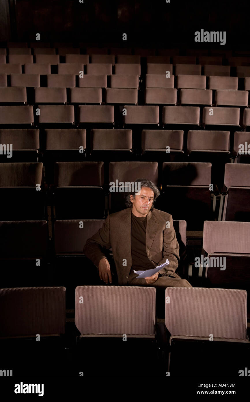 A director sitting in a theater Stock Photo - Alamy