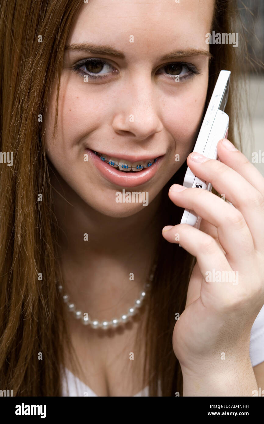 An adolescent girl using a mobile phone Stock Photo - Alamy