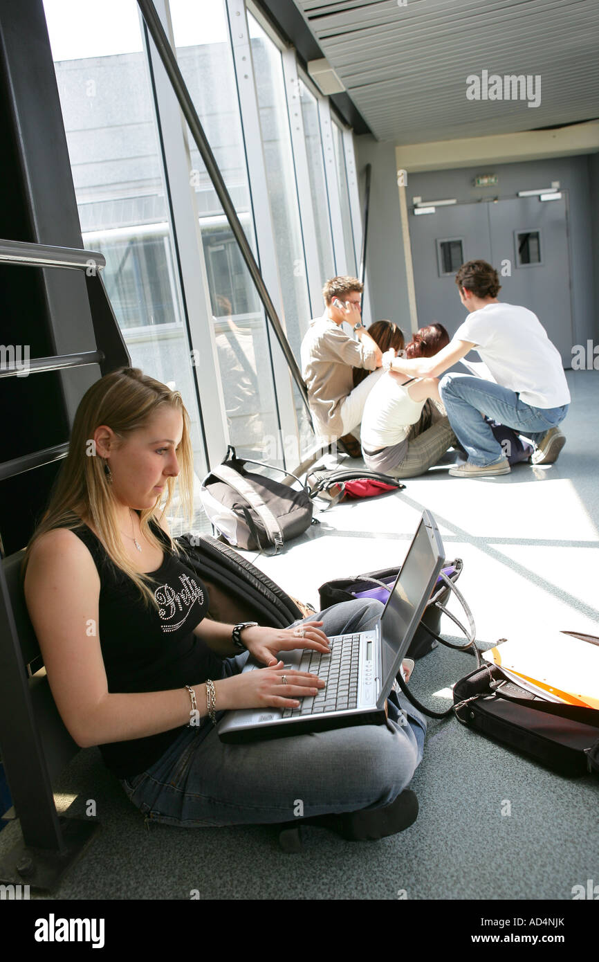 Students sitting on the floor Stock Photo - Alamy