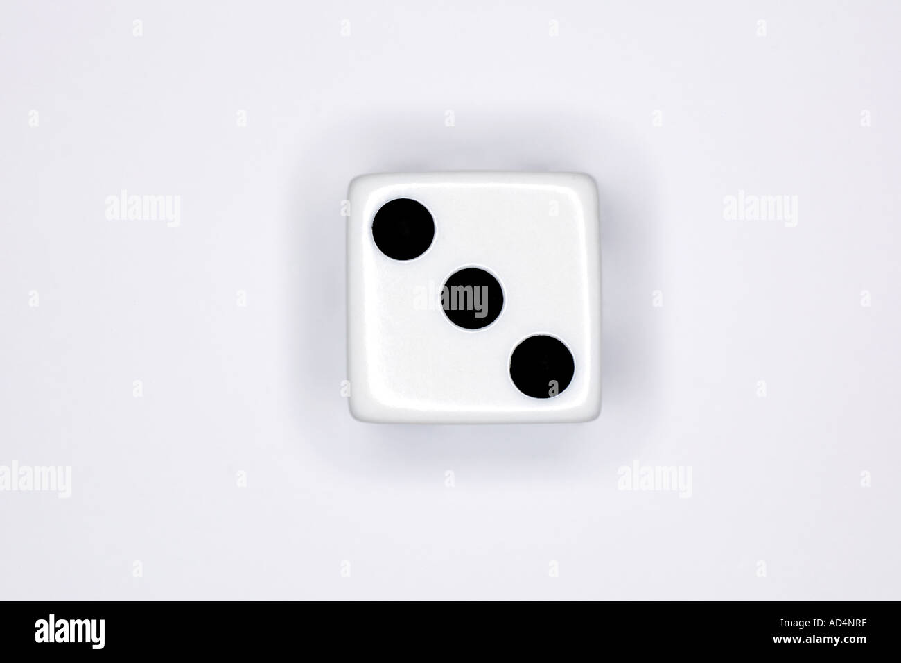 overhead close up of dice showing number three 3 Stock Photo - Alamy