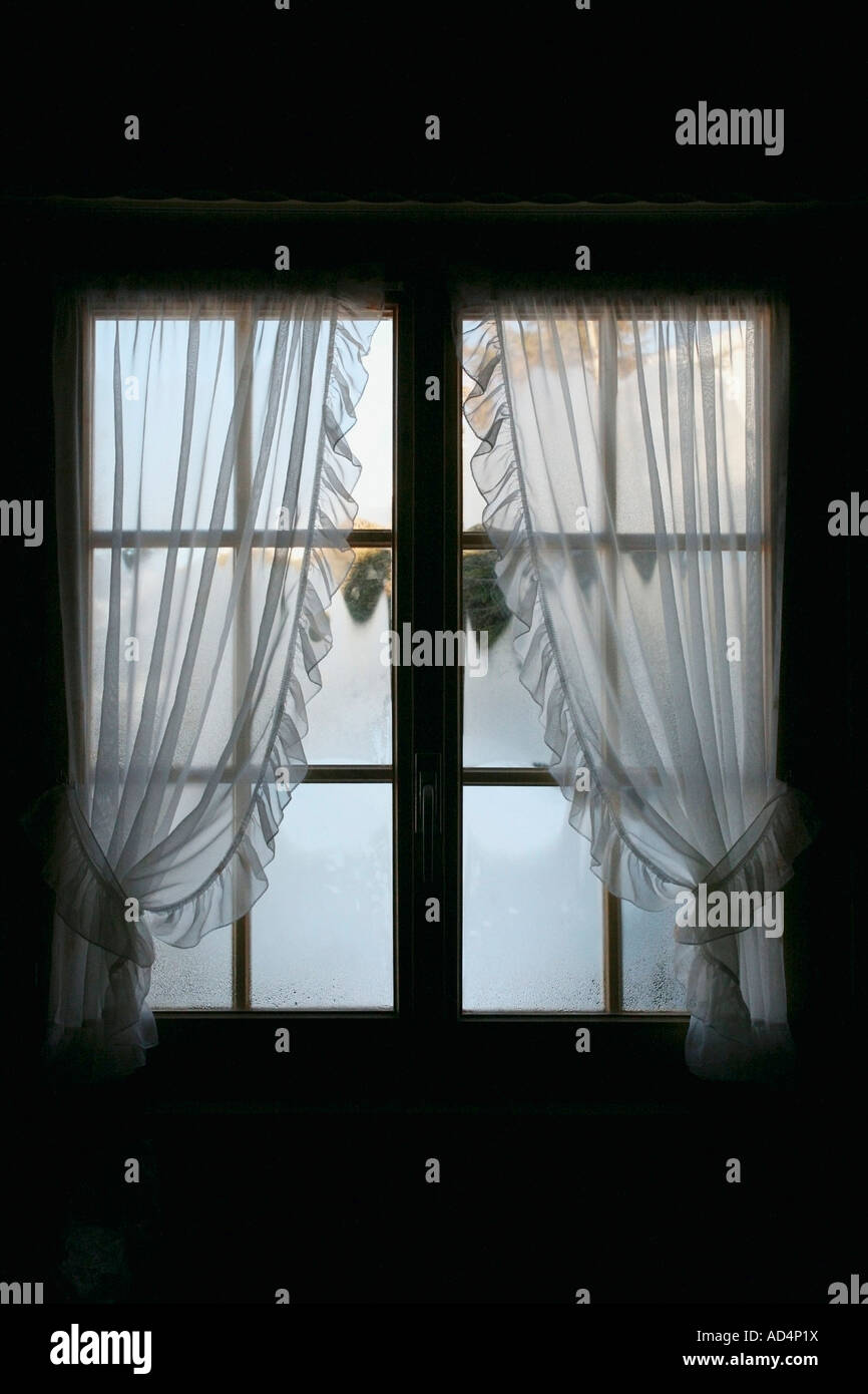 Fog over a window with curtains Stock Photo - Alamy