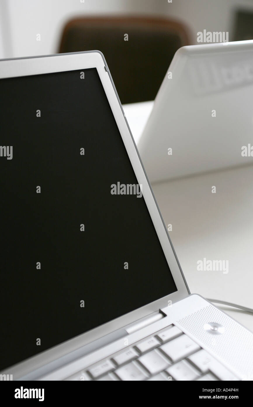 Two laptop computer's on a desk Stock Photo - Alamy