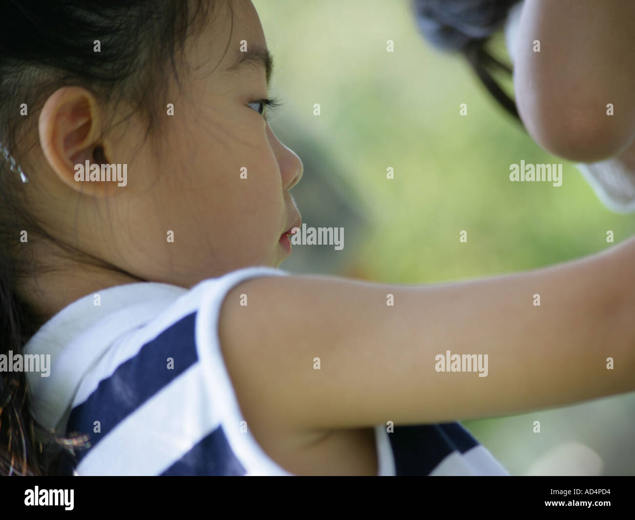 Side profile of a girl looking down Stock Photo - Alamy