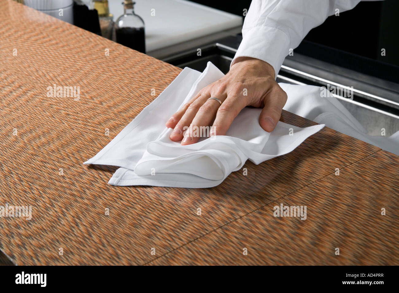 Hand wiping kitchen counter hi-res stock photography and images - Alamy