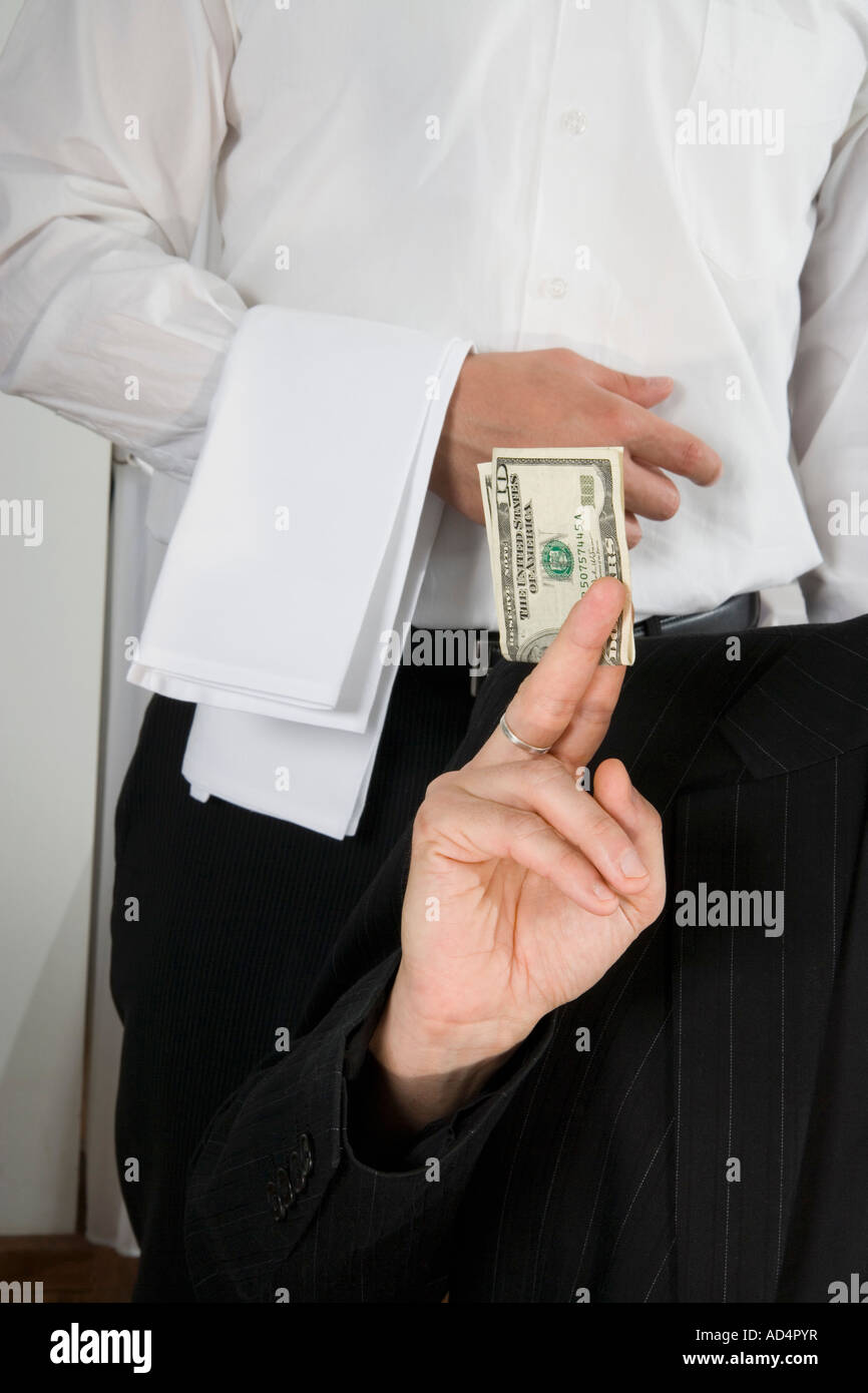 Tipping the waiter Stock Photo - Alamy