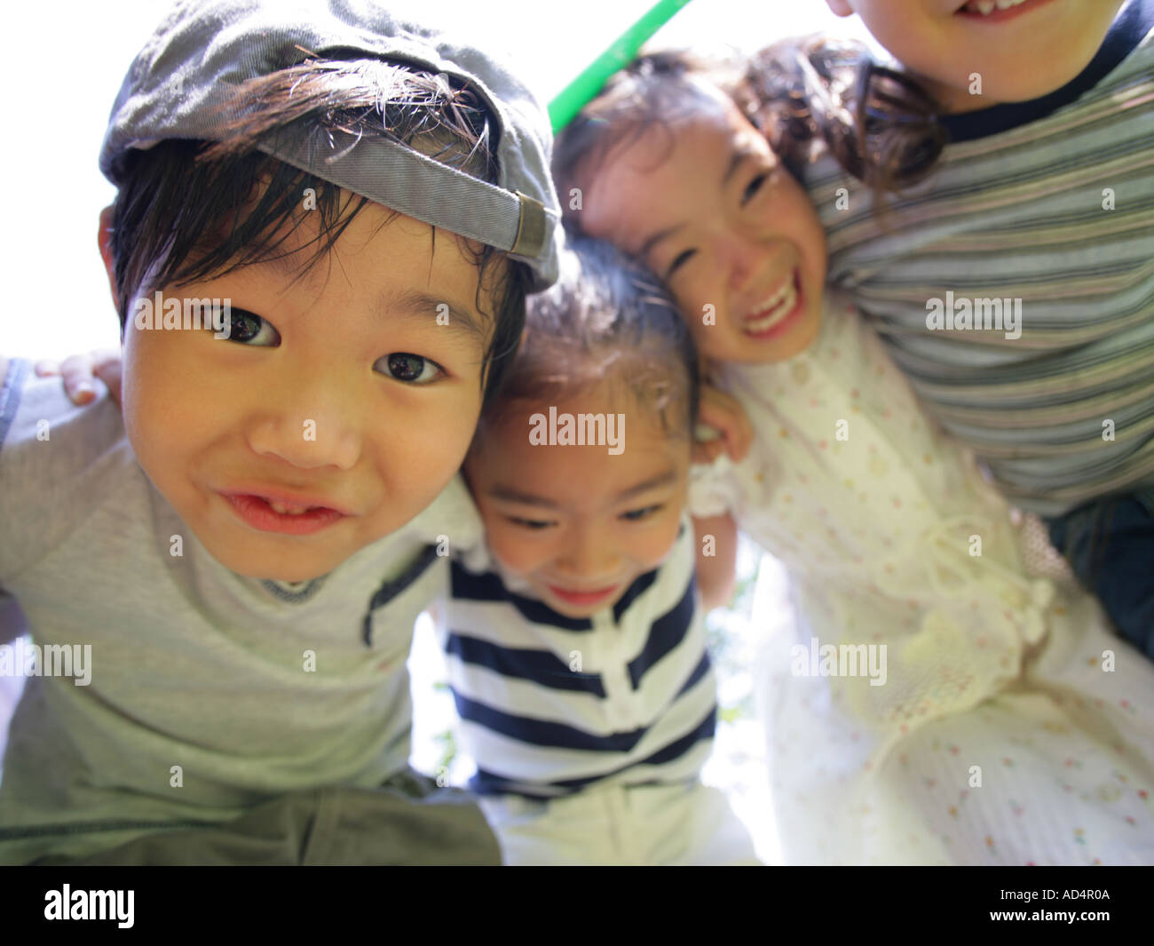 Low angle view of a group of children smiling Stock Photo - Alamy