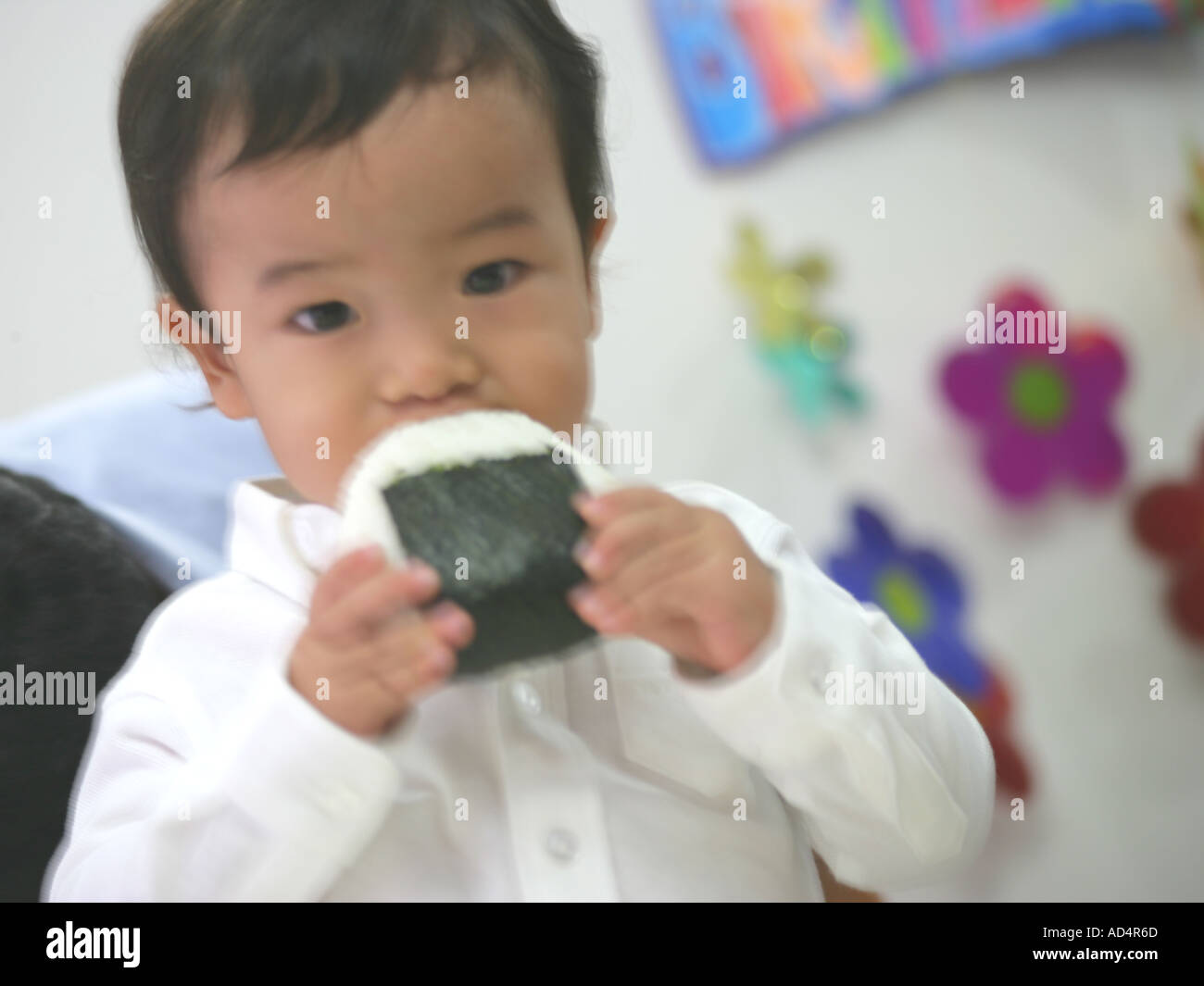 Portrait of a boy eating a pastry Stock Photo - Alamy