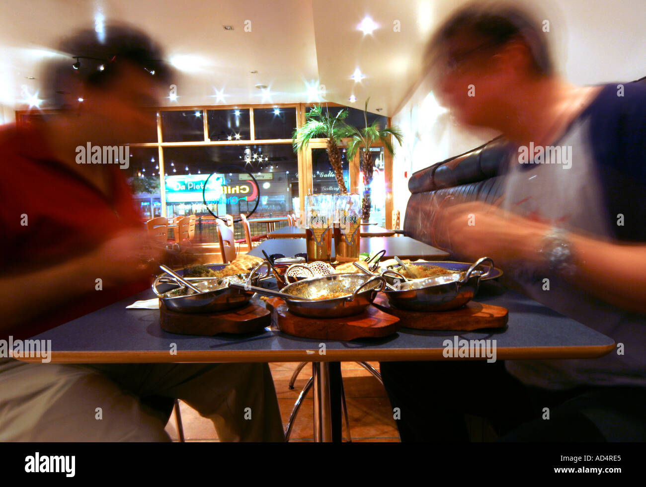 Men eating curry hi-res stock photography and images - Alamy