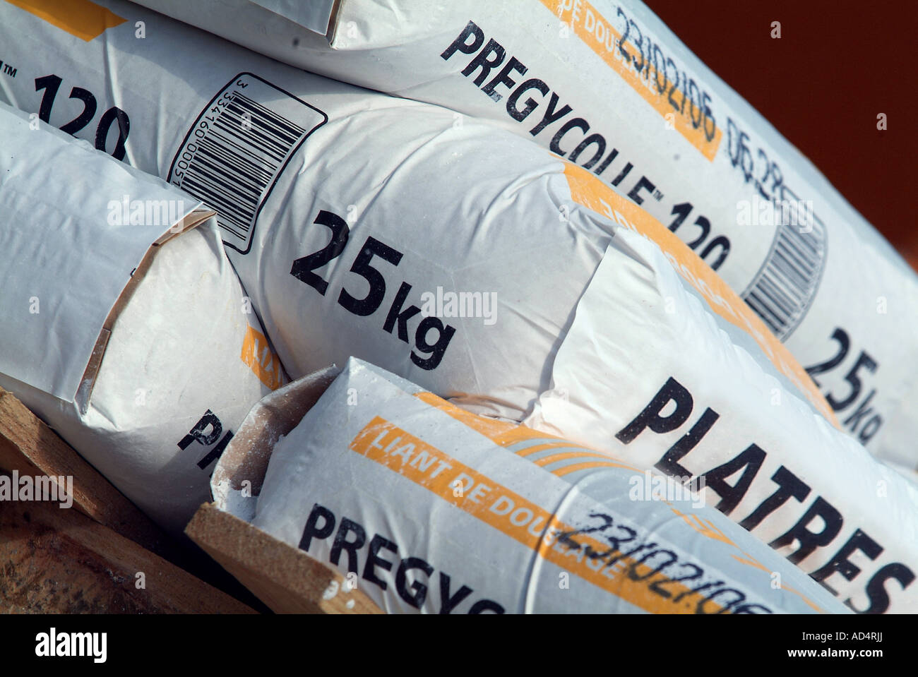 Pile of building material bags Stock Photo - Alamy