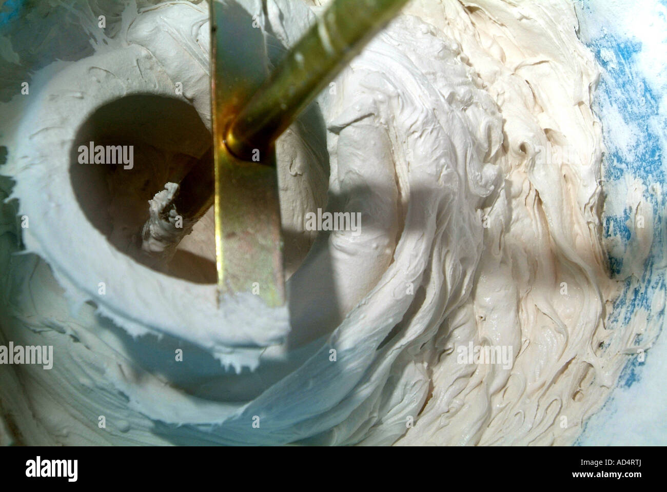 Hand tool mixing plaster Stock Photo - Alamy